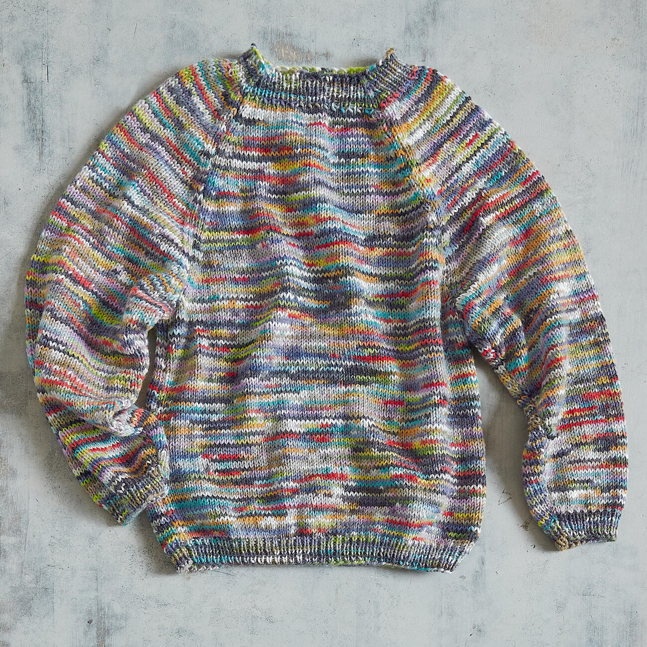Anleitung 304/3, Kinderpullover aus Merino-Print von Junghans-Wolle, 2 versch. Farben